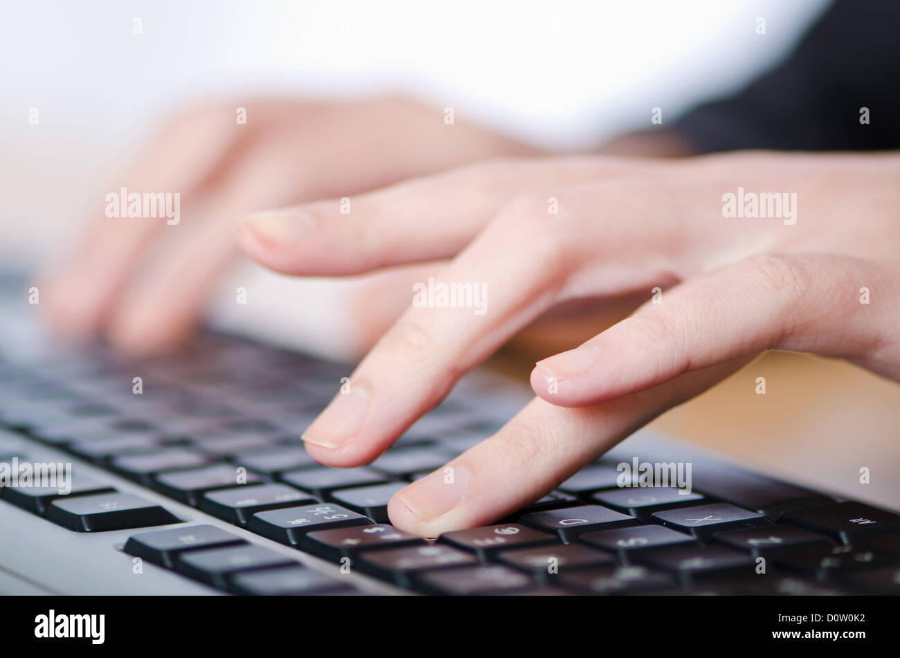 Hands typing on the keyboard Stock Photo - Alamy