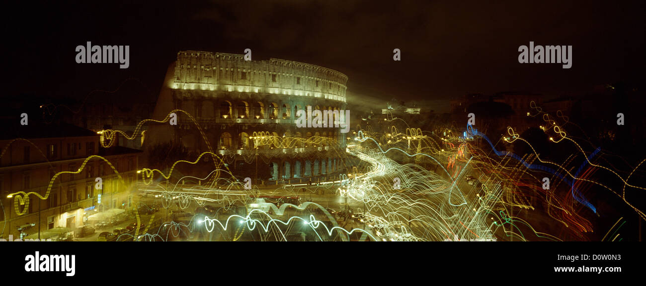 A panoramic view of The Colosseum at night. The Colosseum is an ...