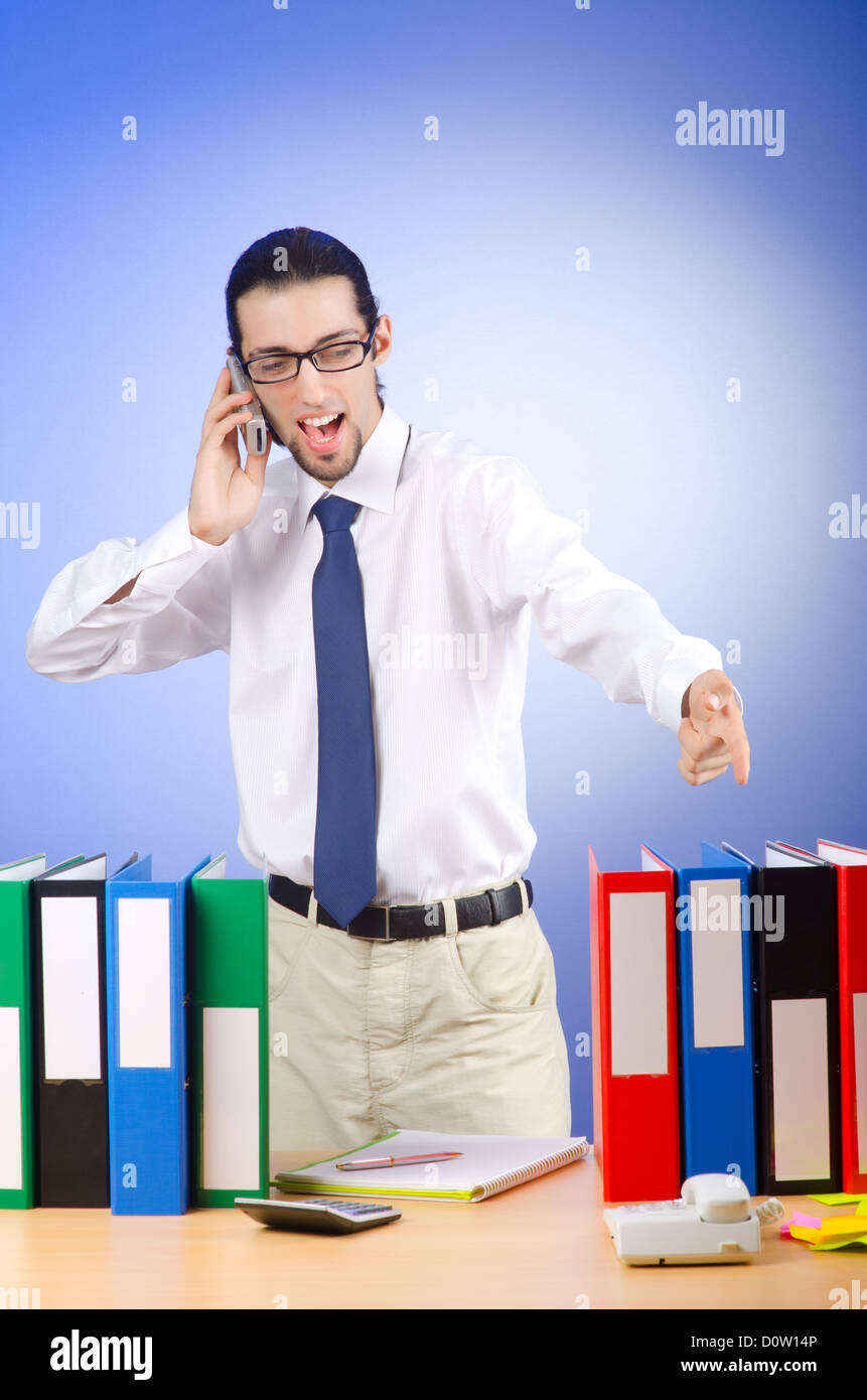 Businessman with many office folders Stock Photo - Alamy
