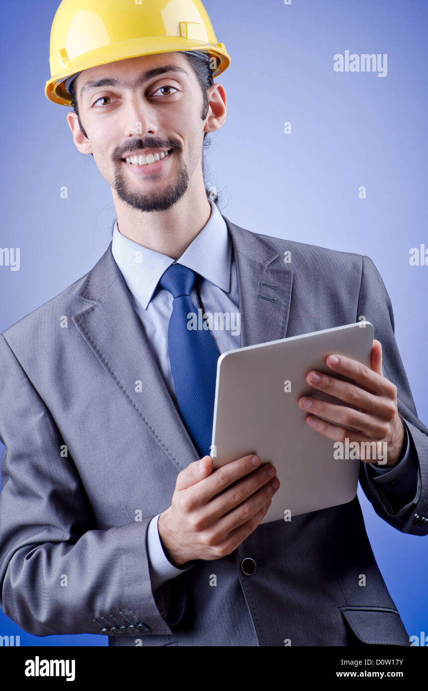 Construction worker working on tablet Stock Photo - Alamy