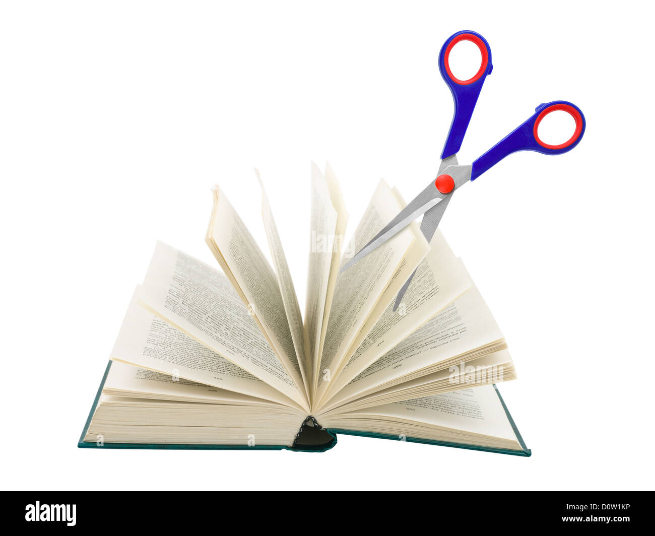 Scissors cutting book Stock Photo - Alamy