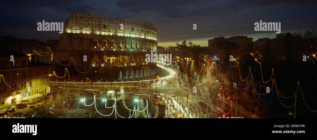 A panoramic view of The Colosseum at night. The Colosseum is an ...