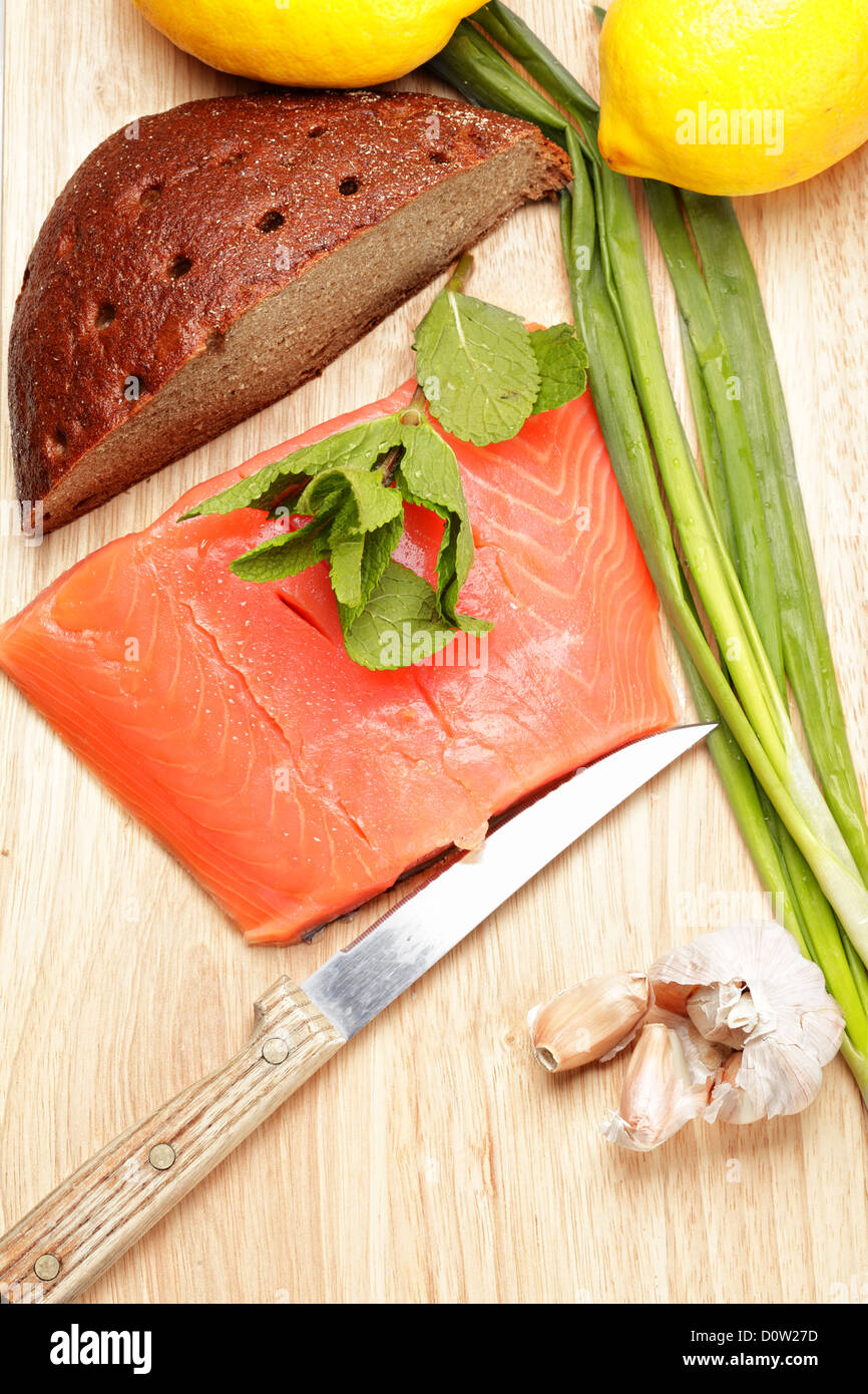 Salmon fish with bread and vegetables Stock Photo - Alamy
