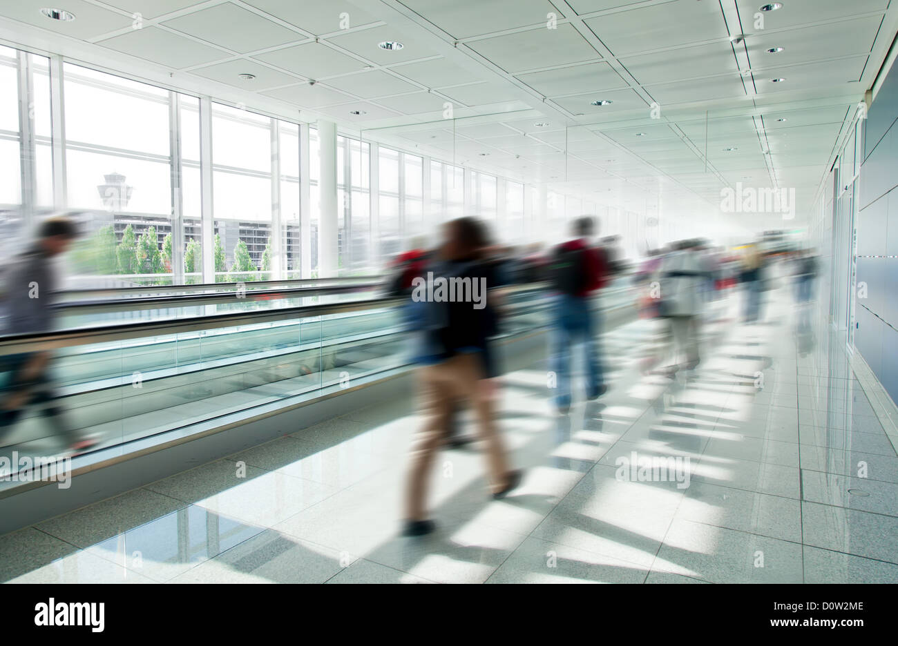 People crowd in rush at airport Stock Photo - Alamy