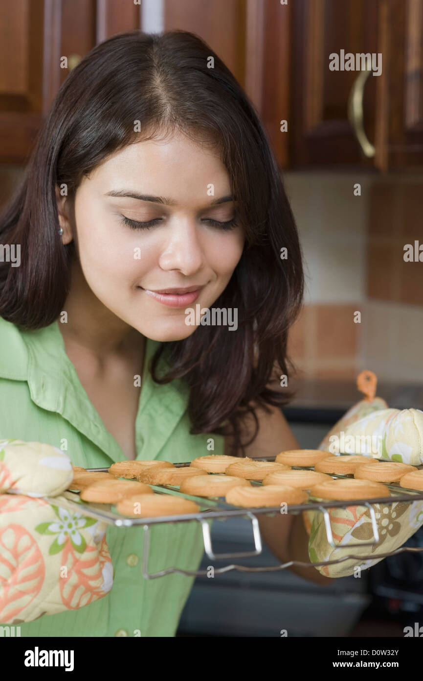 Woman smelling baked cookies hi-res stock photography and images - Alamy