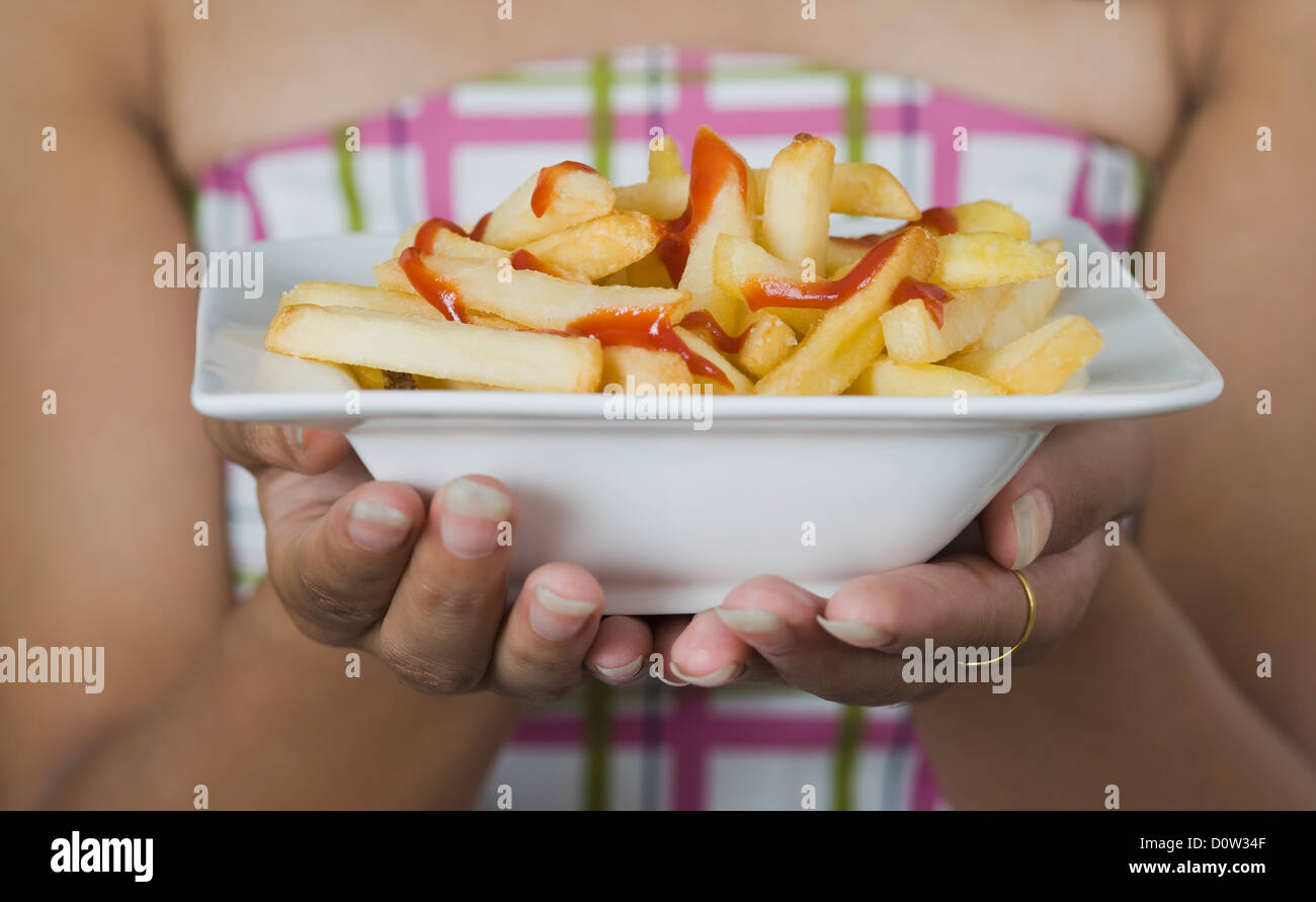 Hand holding french fries in hi-res stock photography and images - Alamy