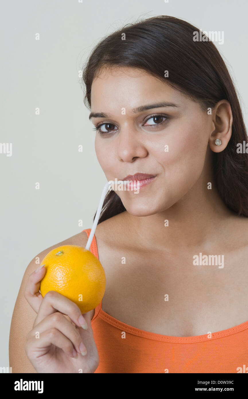 Young smiling lady drinking orange hi-res stock photography and images ...