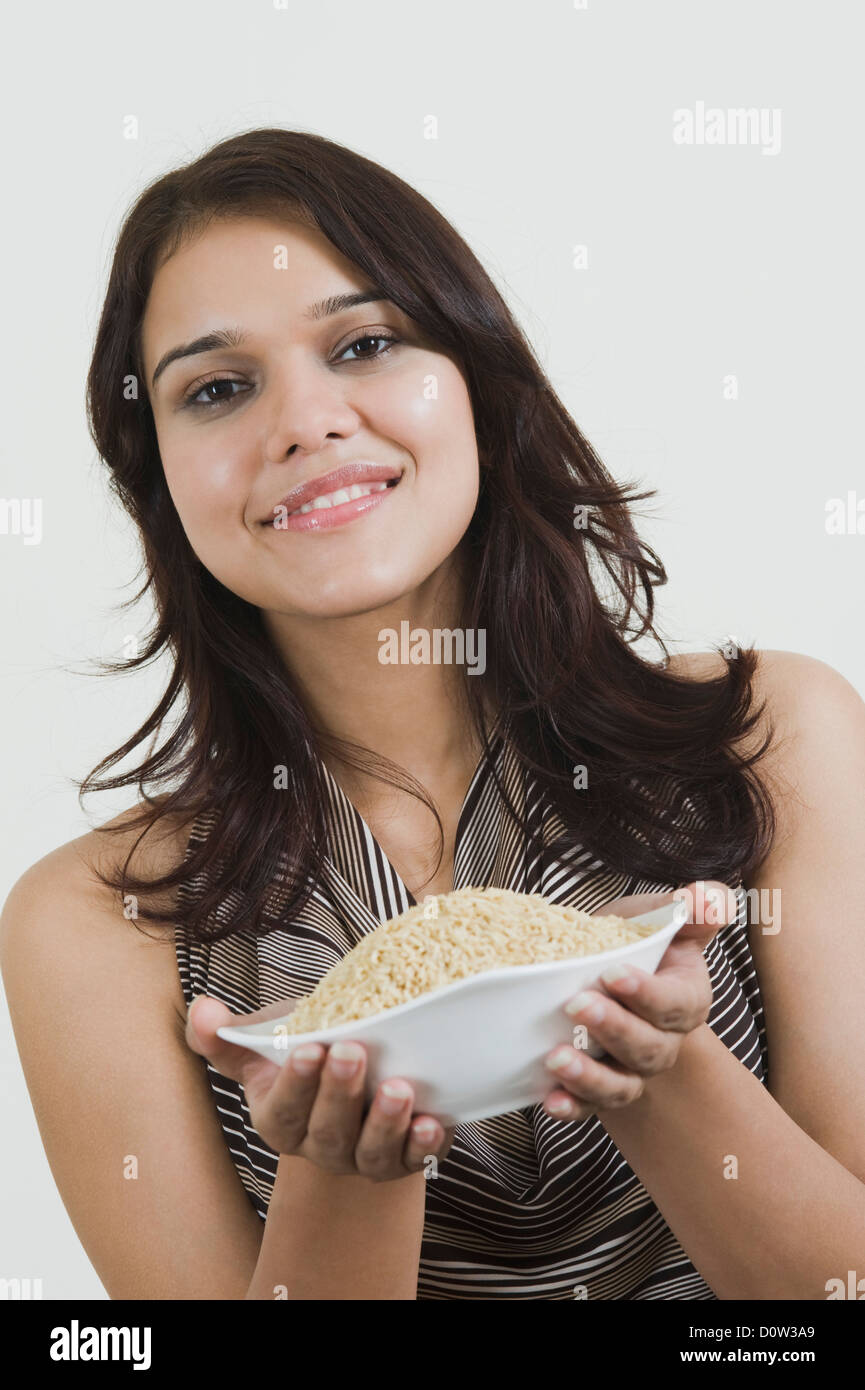 Woman eating rice vertical hi-res stock photography and images - Alamy