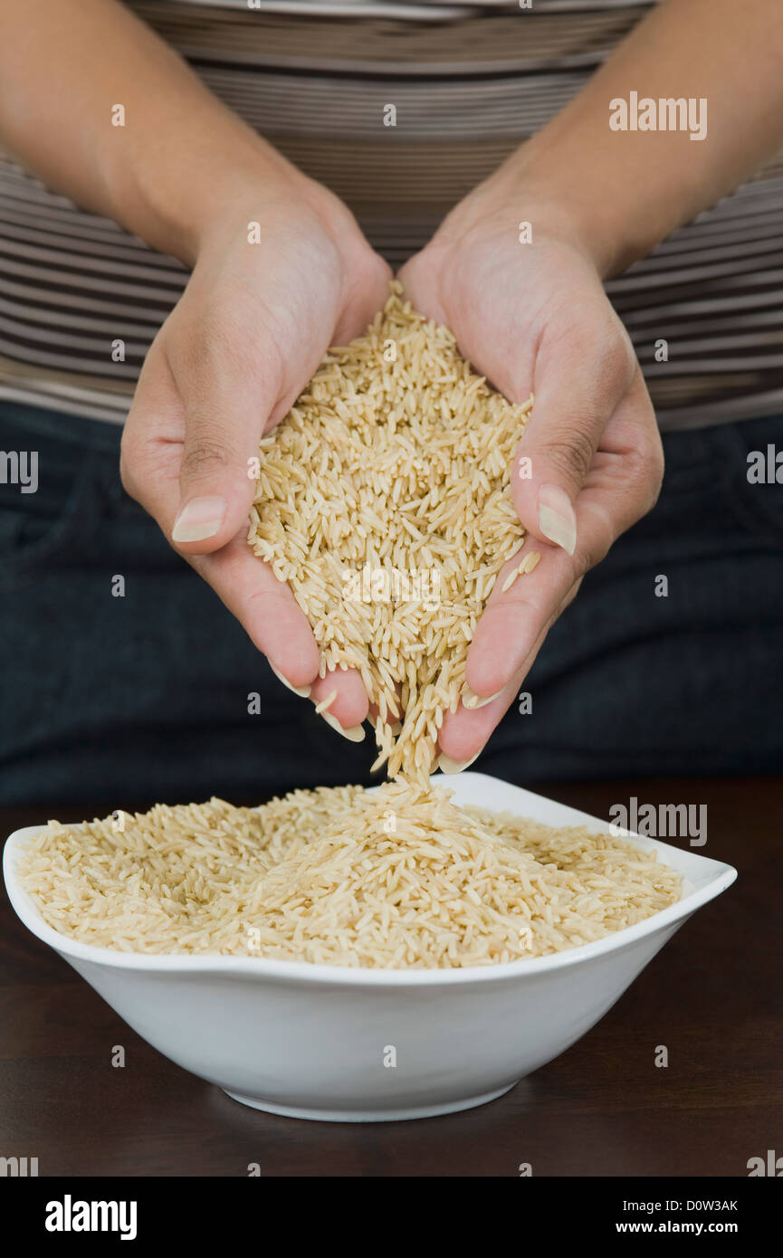 Woman pouring rice hi-res stock photography and images - Alamy