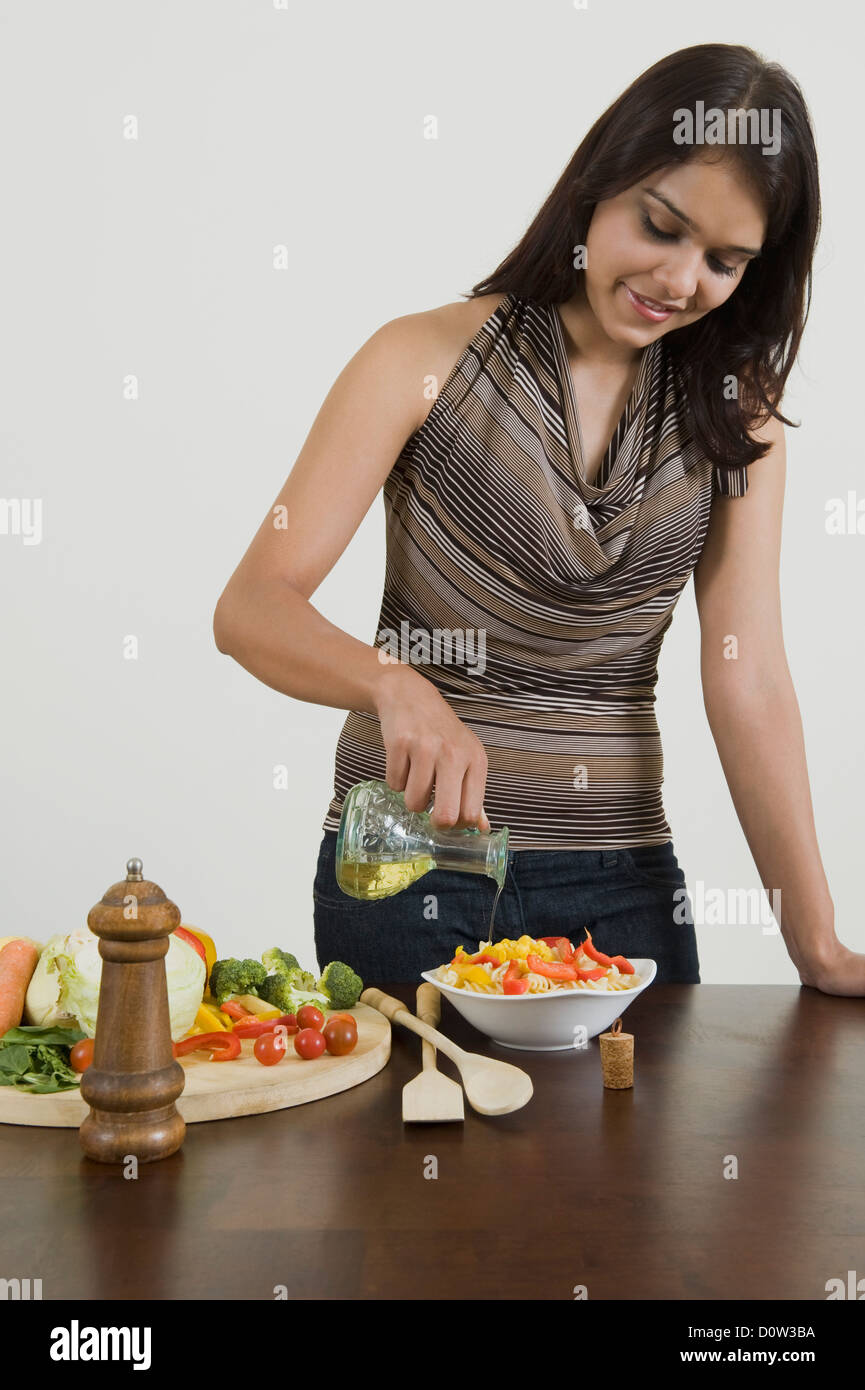 Indian woman pouring oil hi-res stock photography and images - Alamy