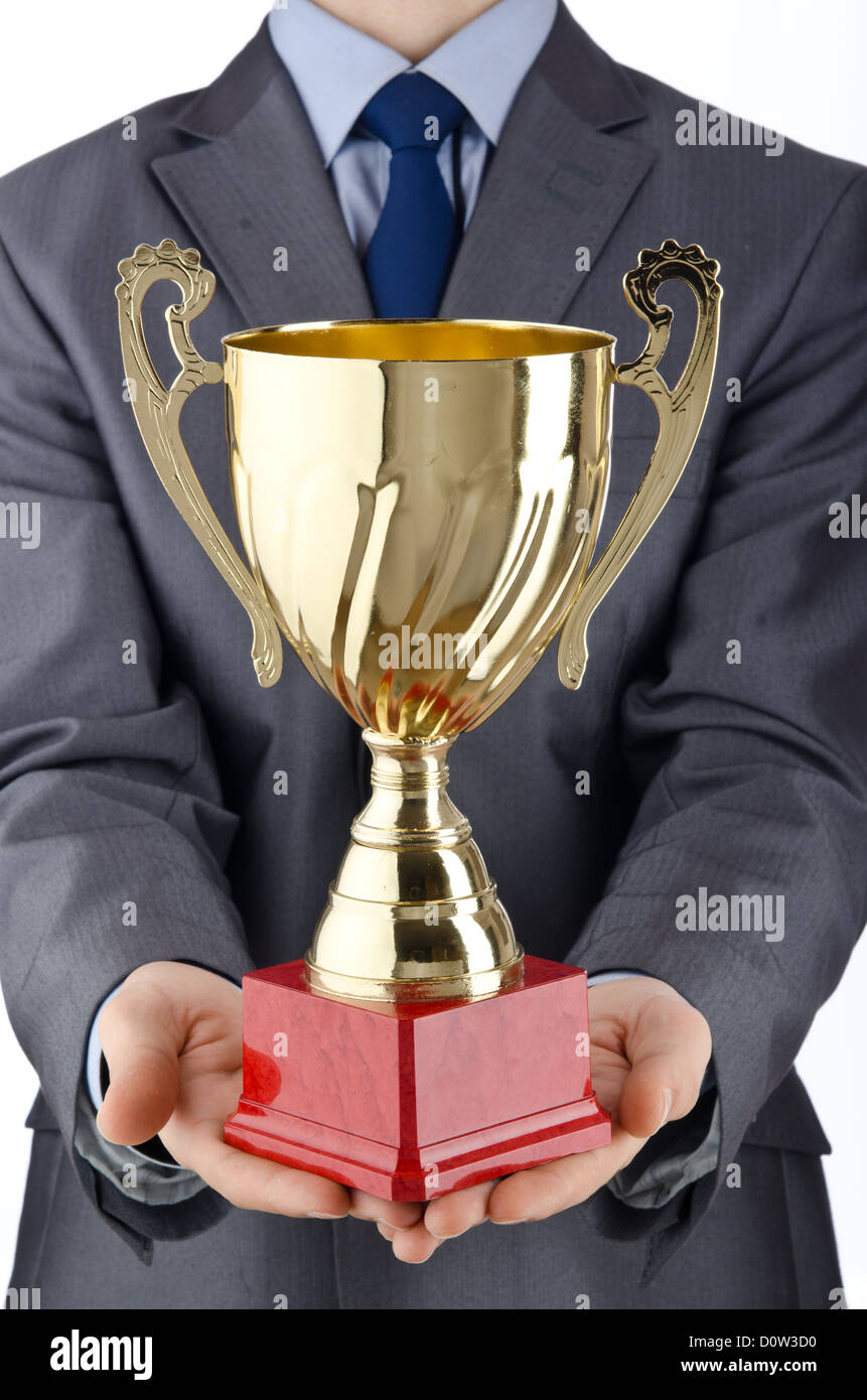 Man being awarded with golden cup Stock Photo - Alamy