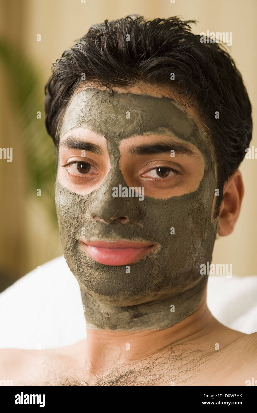 Portrait of a man with mud pack Stock Photo - Alamy