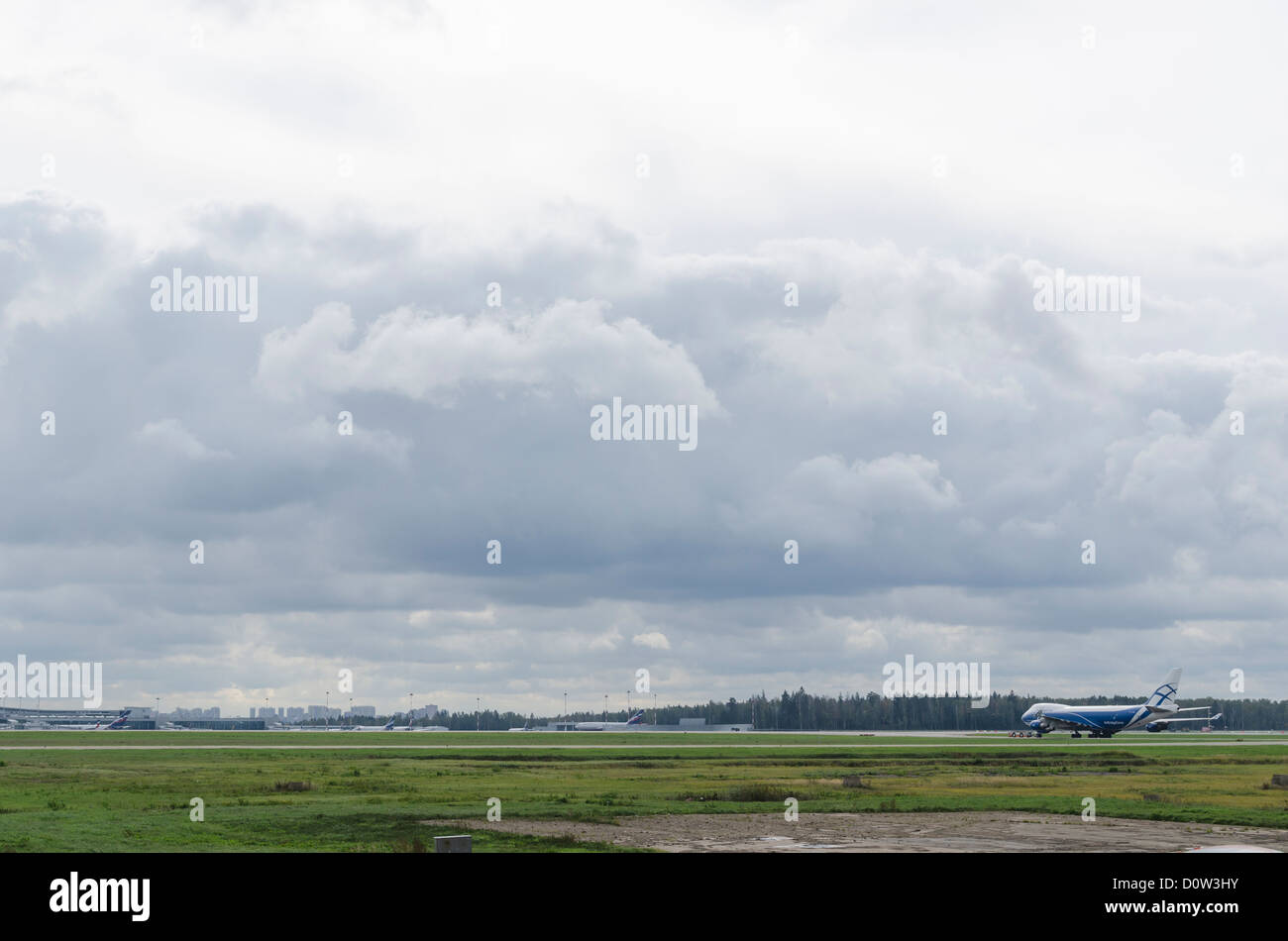 jet plane airport airfield cloudy clouds horizont Stock Photo - Alamy