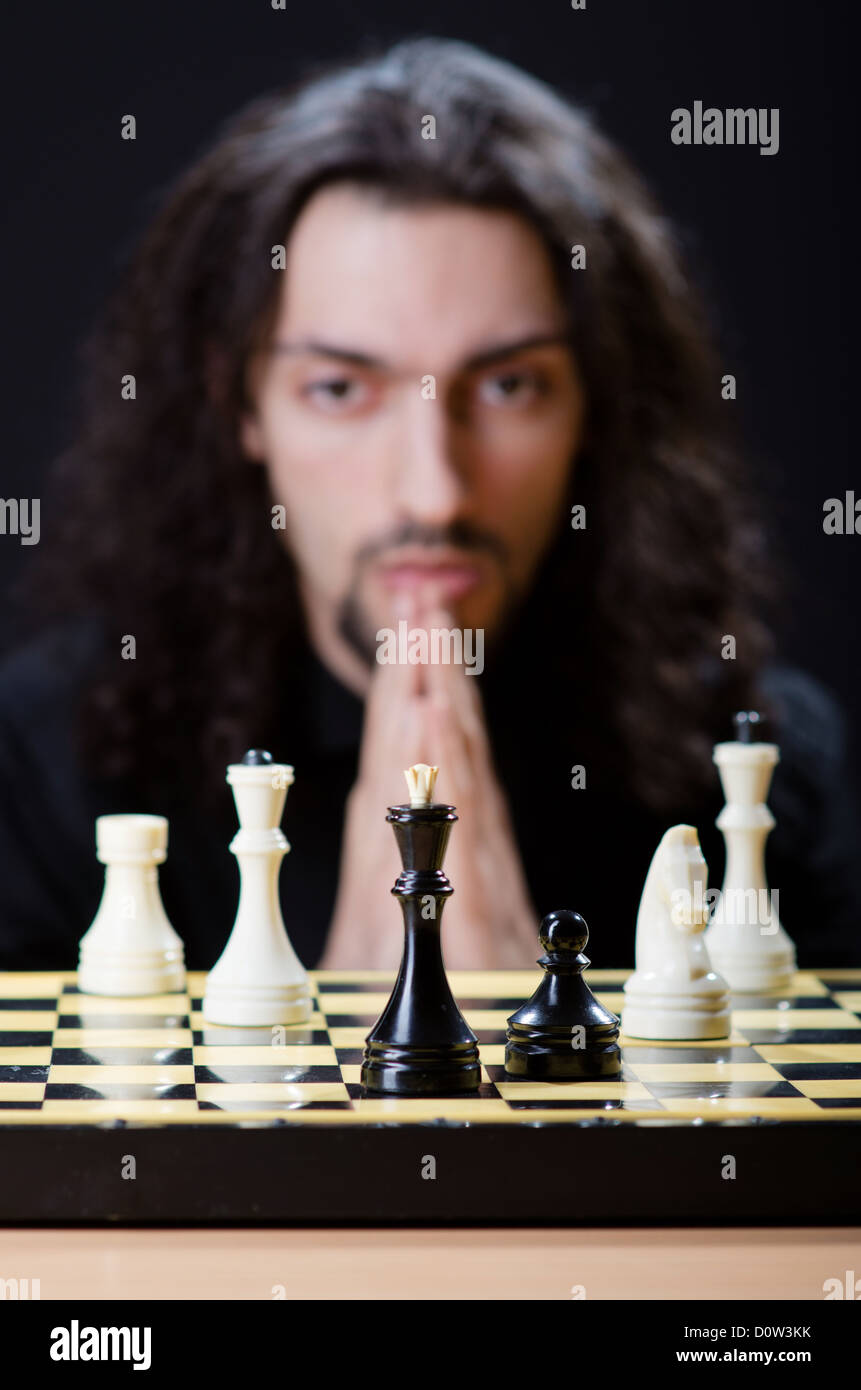 Chess player playing his game Stock Photo - Alamy