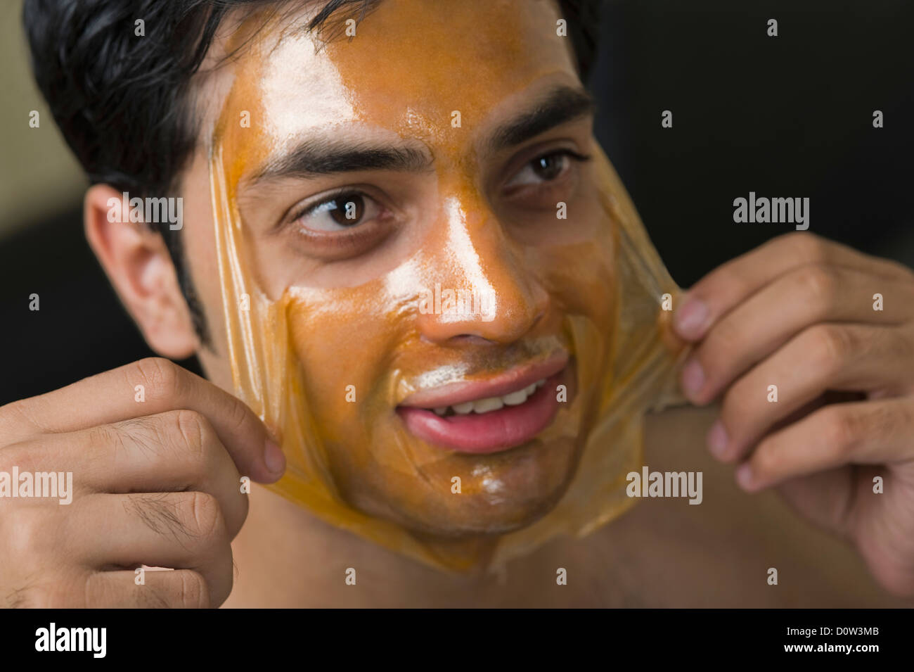 Man hold facial expression mask hi-res stock photography and images - Alamy
