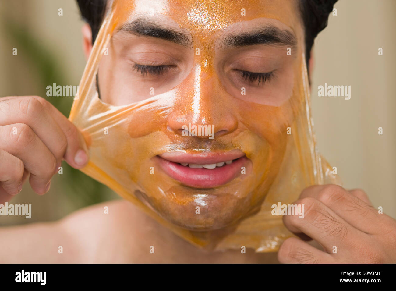 Removing peel off mask hi-res stock photography and images - Alamy