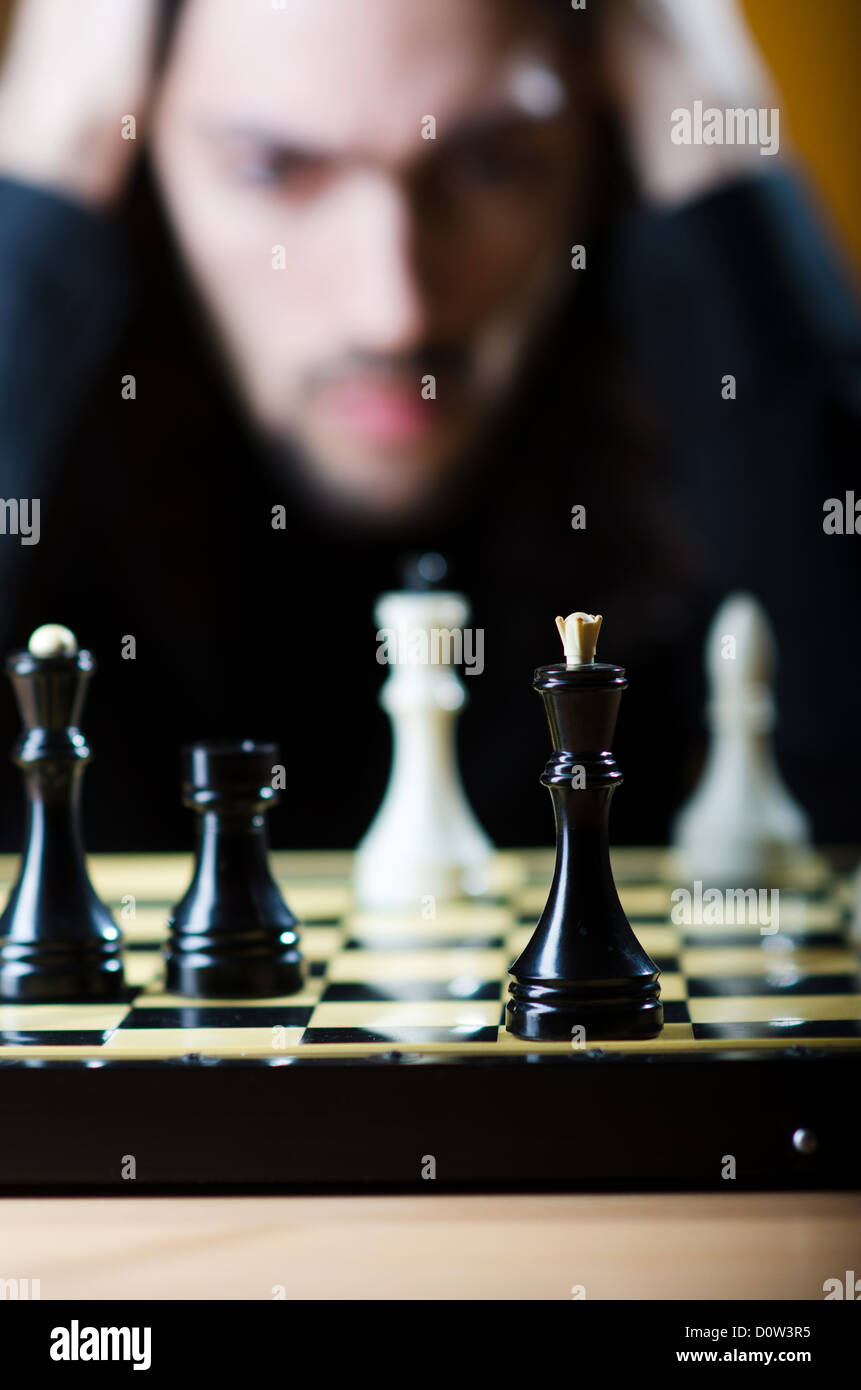 Chess player playing his game Stock Photo - Alamy