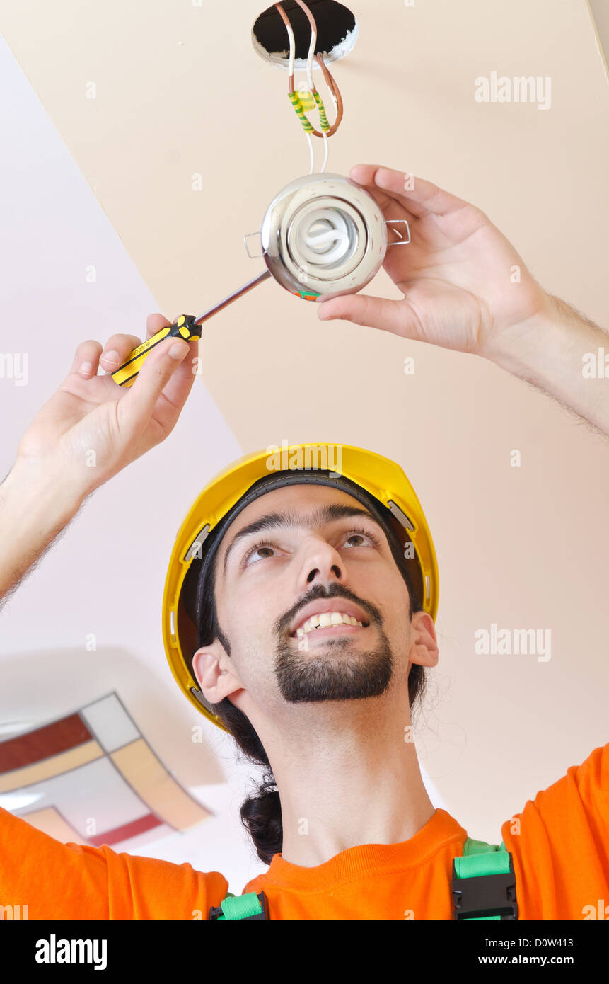 Electrician working on cabling lighting Stock Photo - Alamy
