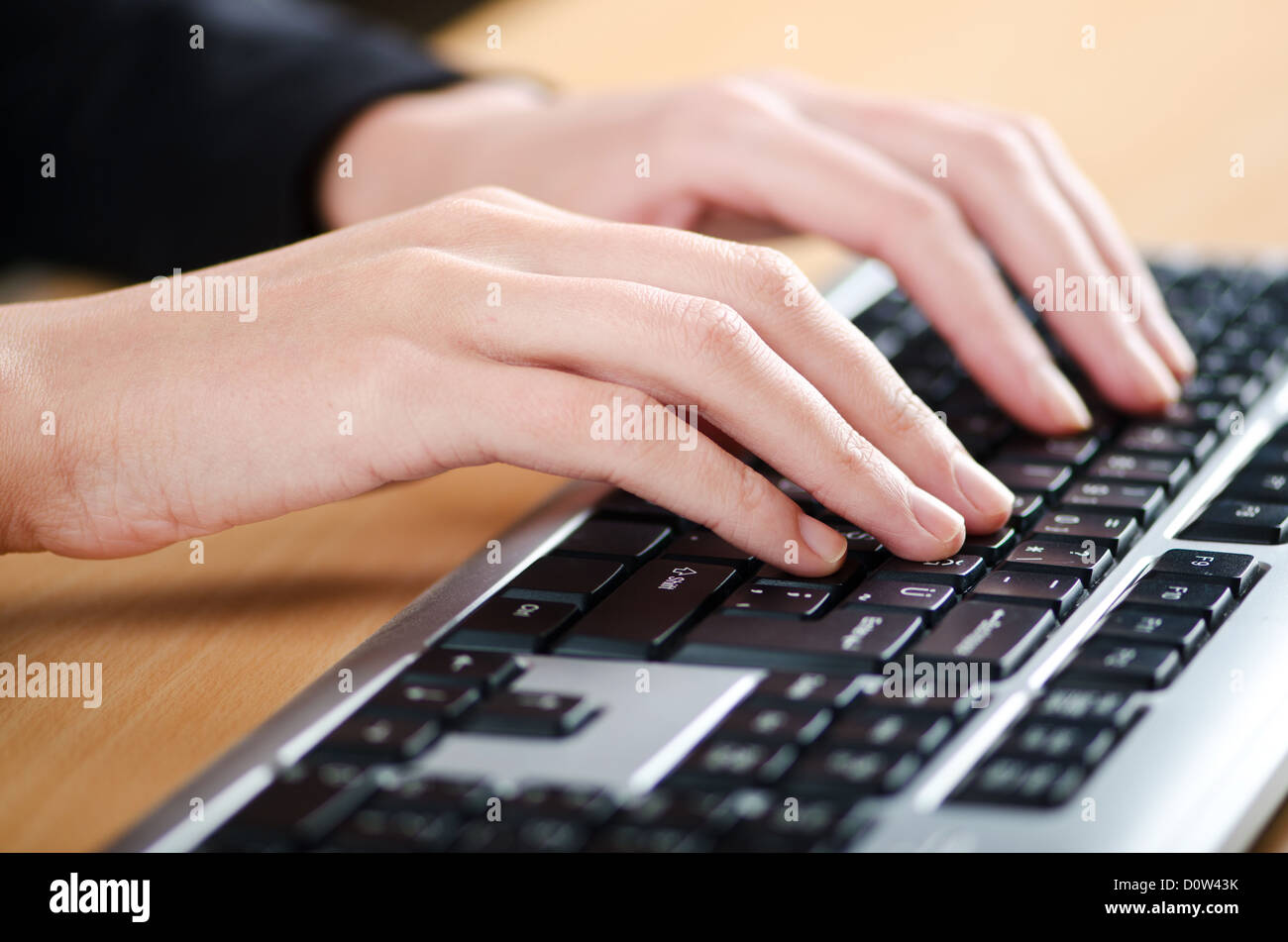Hands typing on the keyboard Stock Photo - Alamy