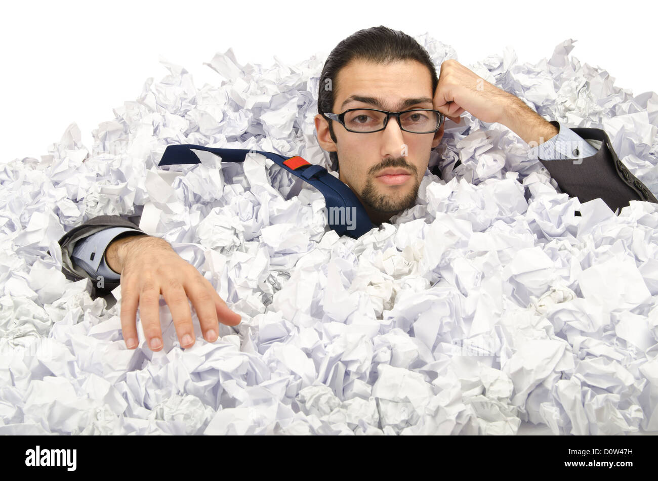 Man with lots of waste paper Stock Photo - Alamy