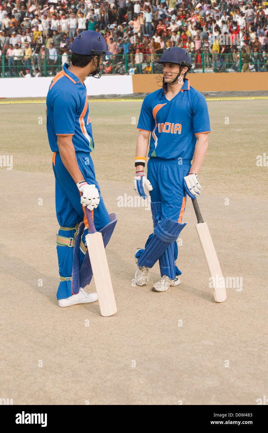 Two cricket batsmen discussing at wicket Stock Photo - Alamy