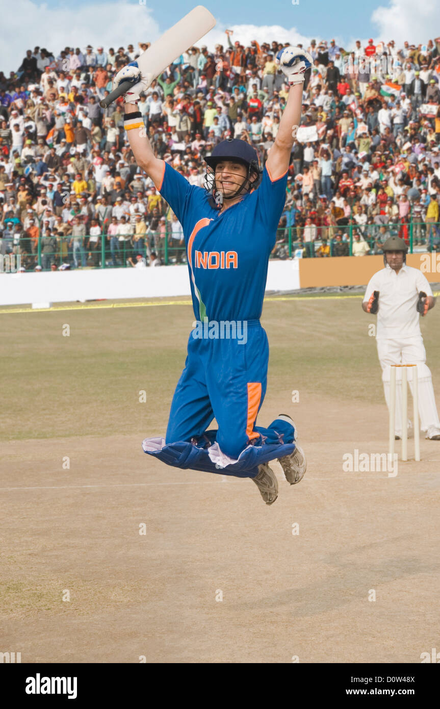 Cricket batsman jumping in excitement Stock Photo - Alamy