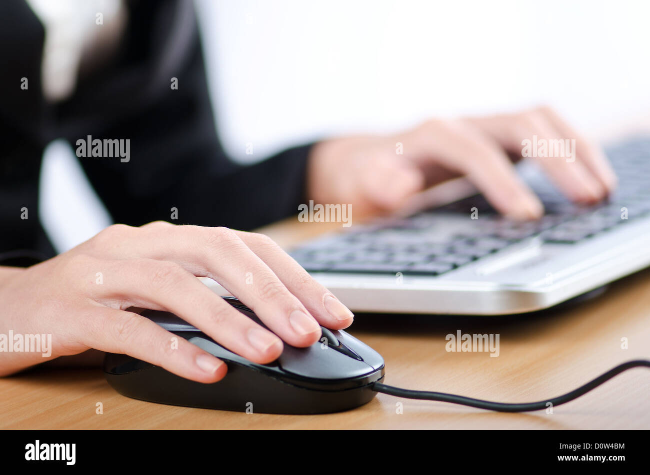 Hands typing on the keyboard Stock Photo - Alamy