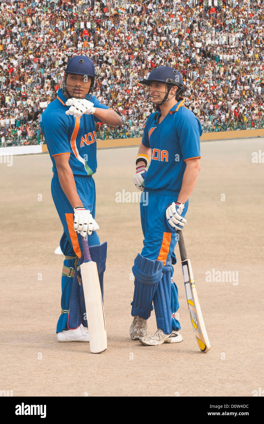 Two cricket batsmen discussing at wicket Stock Photo - Alamy