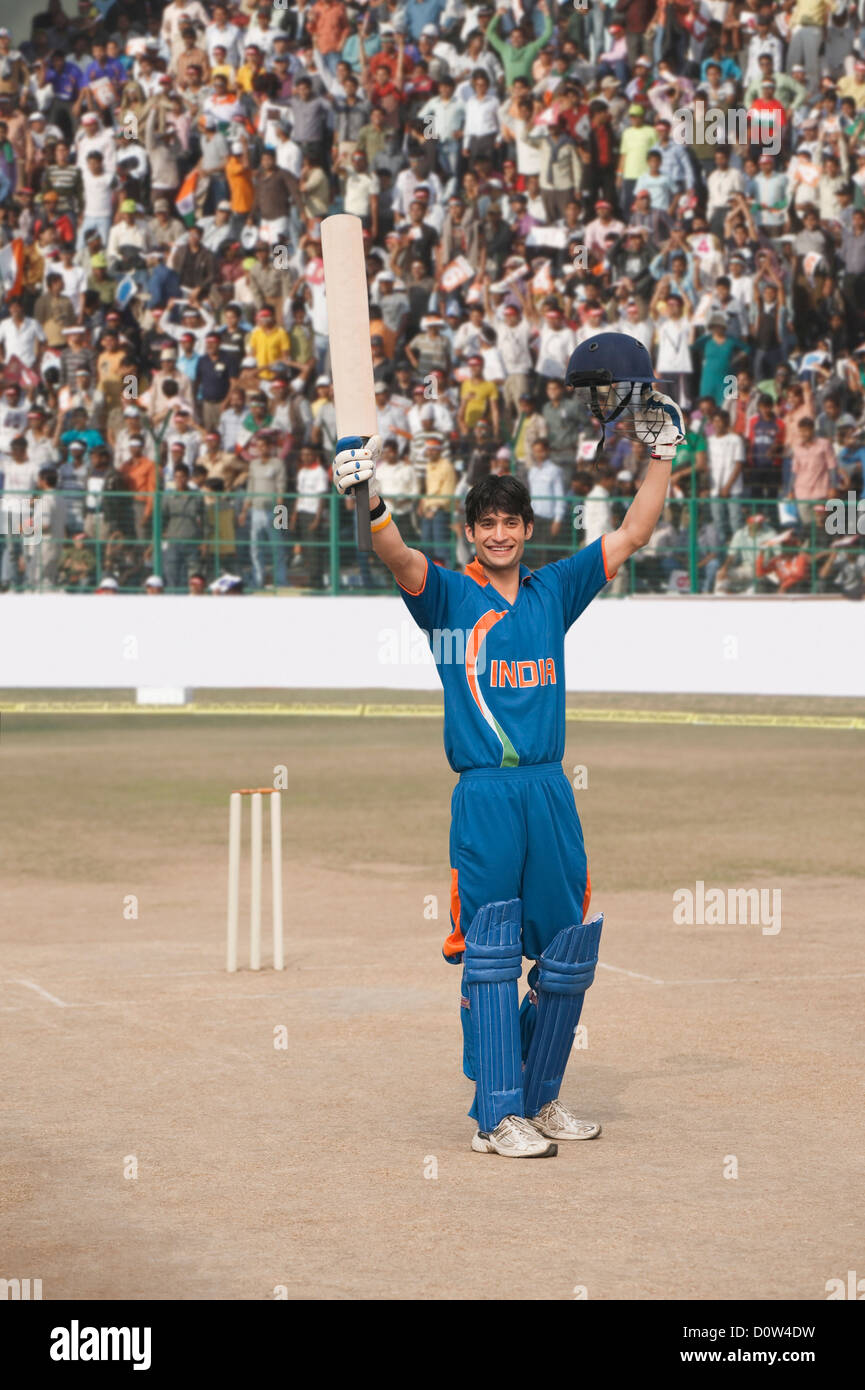 Cricket batsman celebrating success Stock Photo - Alamy