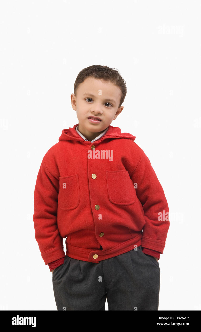 Boy standing with hands in his pockets Stock Photo - Alamy