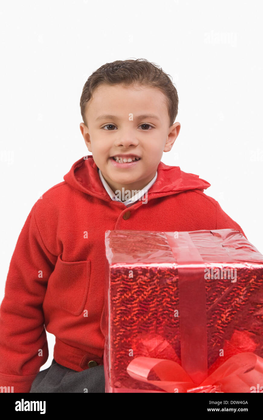 Boy smiling with a present Stock Photo - Alamy