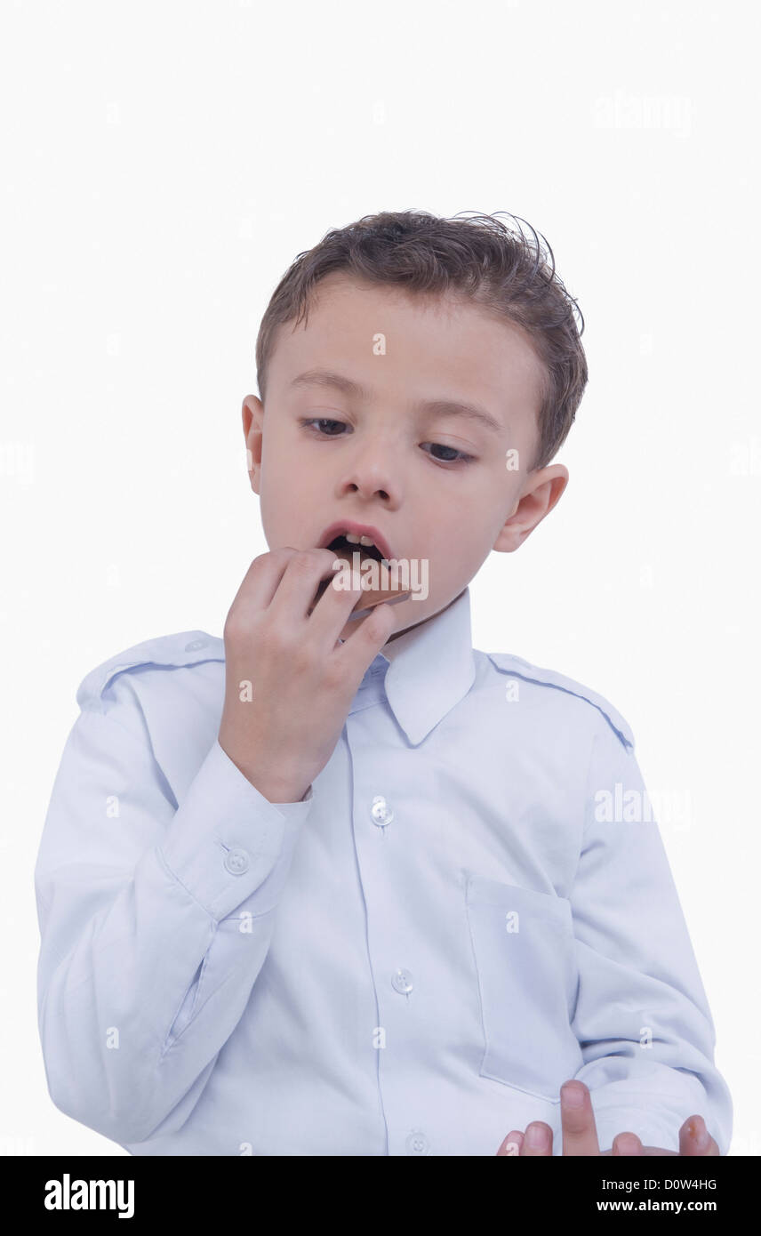 Boy eating a chocolate Stock Photo - Alamy