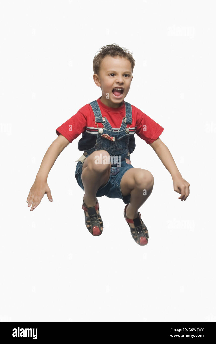 Boy jumping and shouting Stock Photo - Alamy