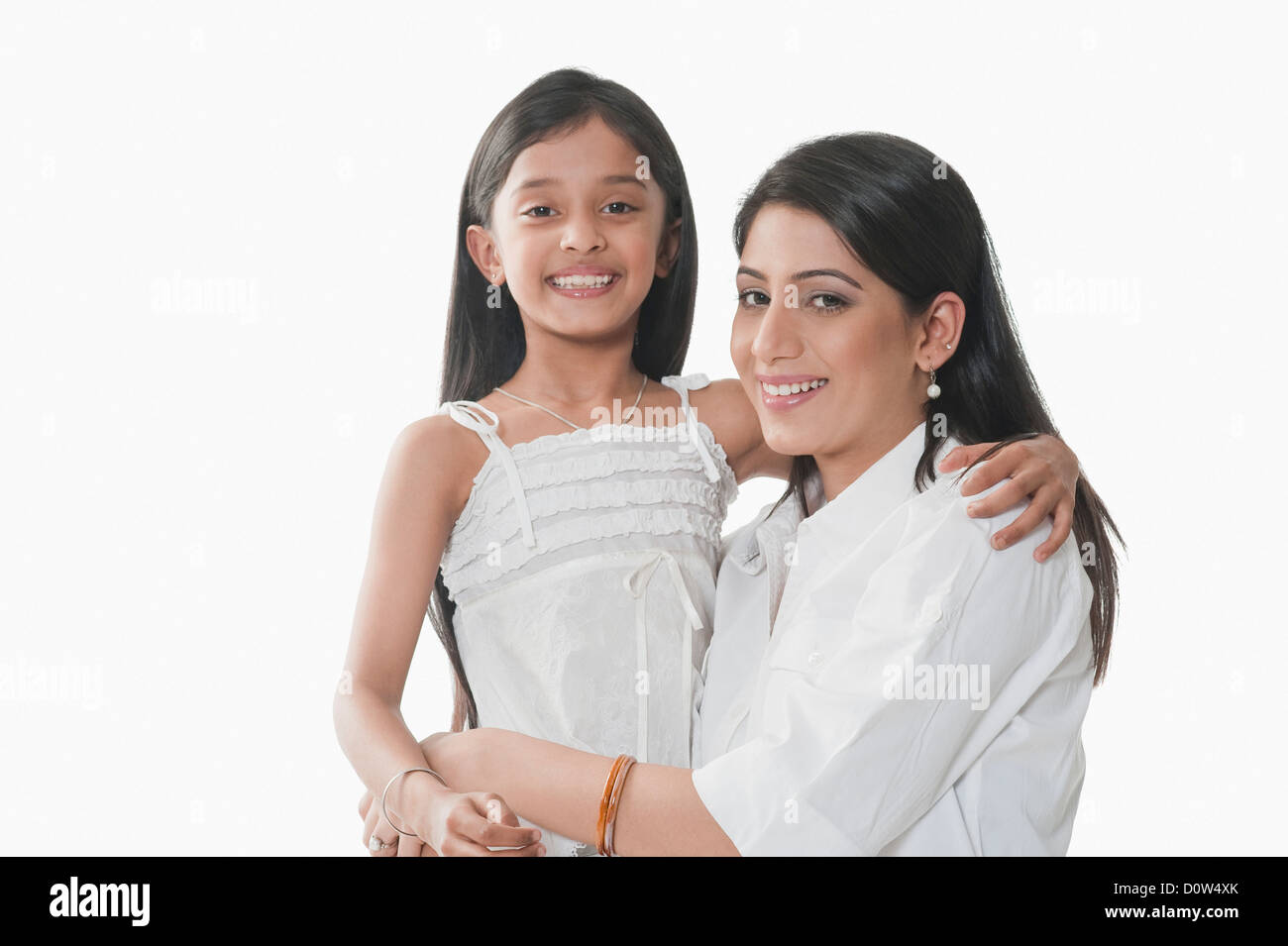 Woman hugging her daughter Stock Photo - Alamy