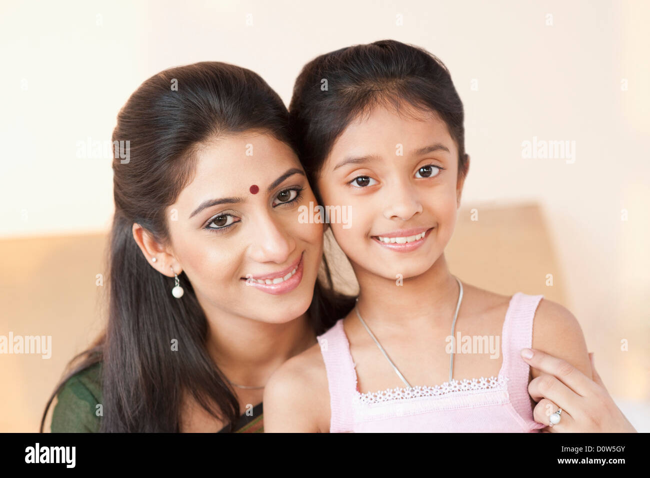 Portrait of a woman smiling with her daughter Stock Photo - Alamy