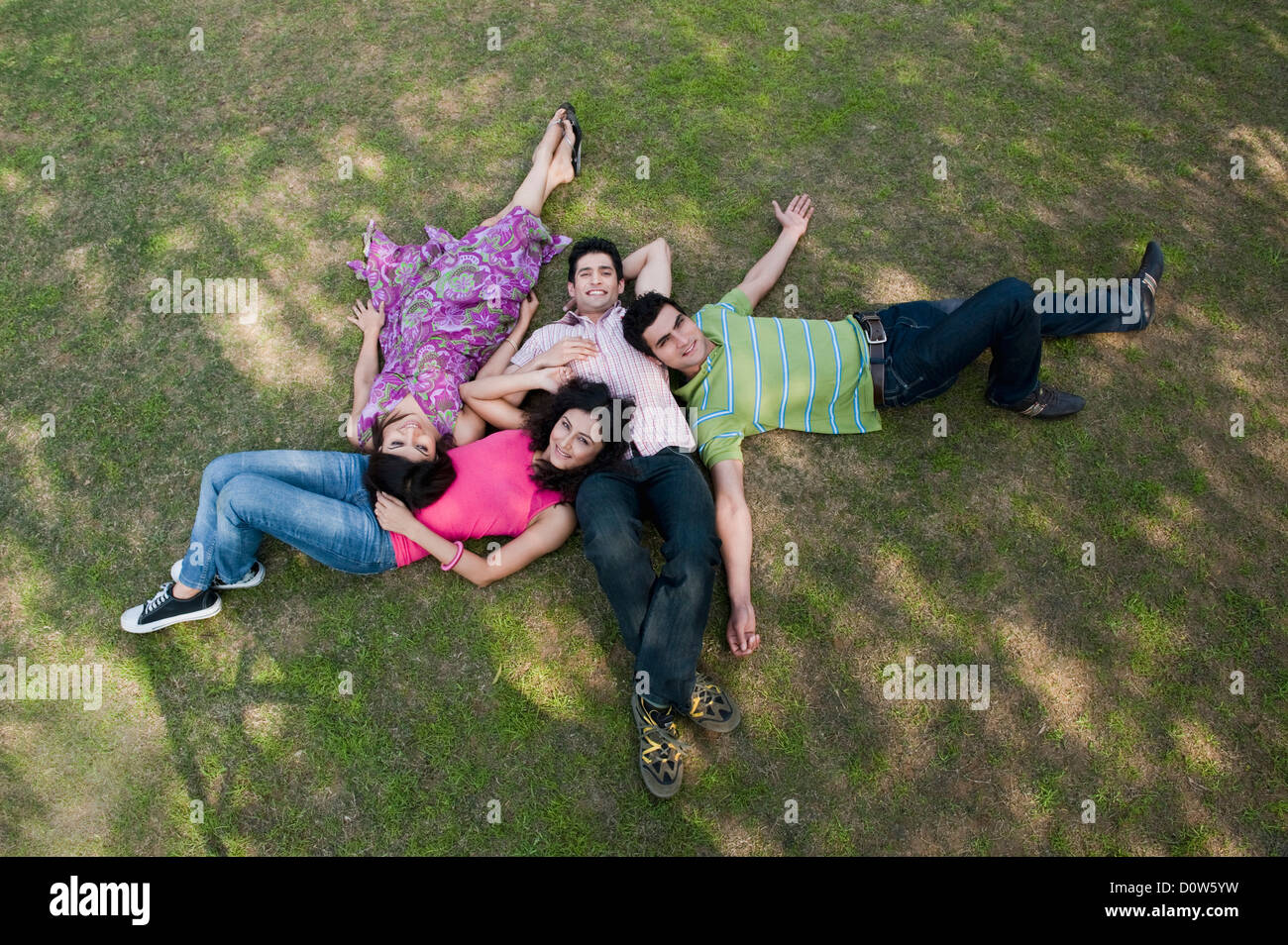 Indian friends lying down hi-res stock photography and images - Alamy