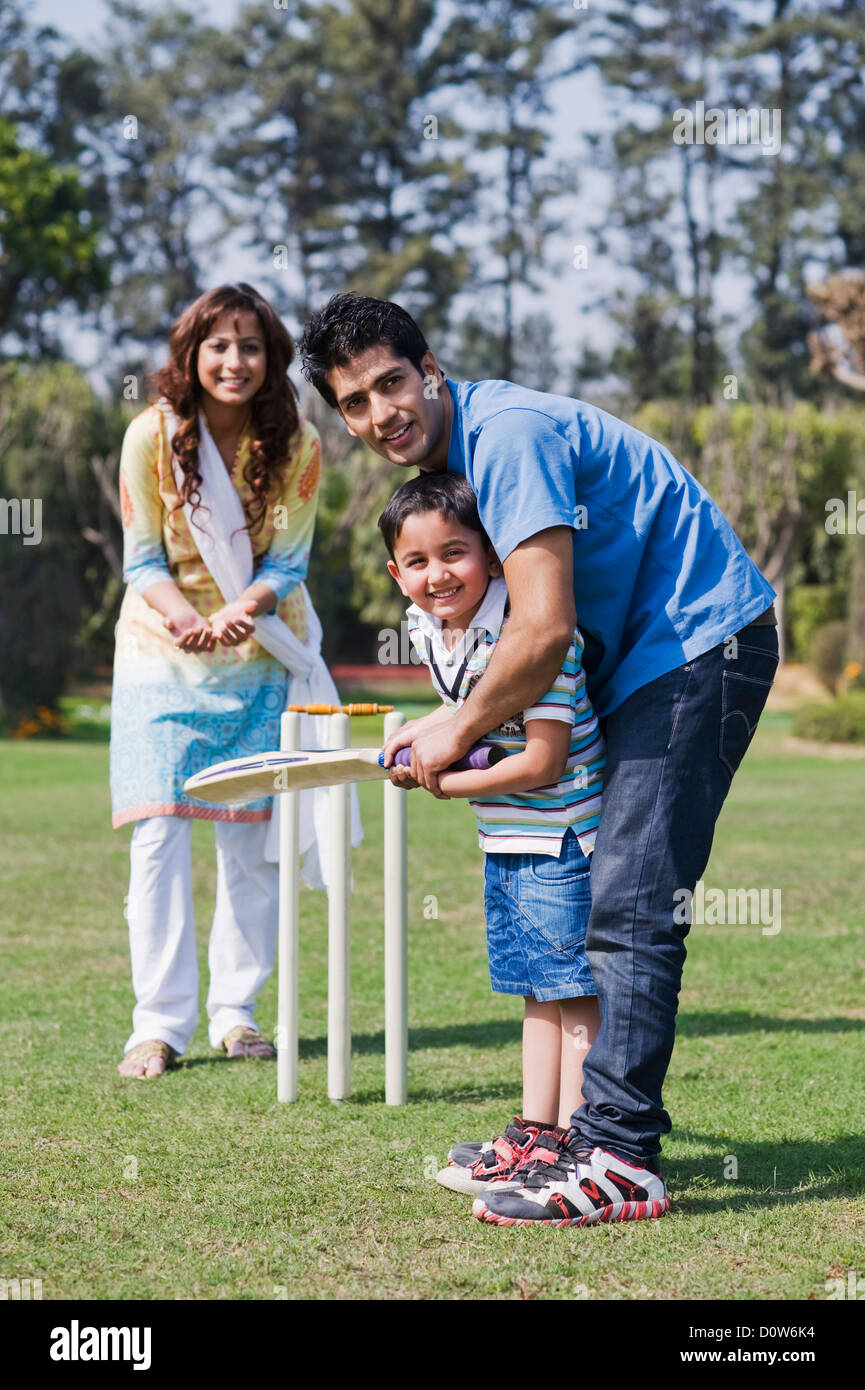 Couple playing cricket with their son, Gurgaon, Haryana, India Stock ...
