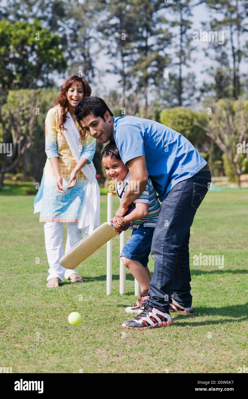 Couple playing cricket with their son, Gurgaon, Haryana, India Stock ...
