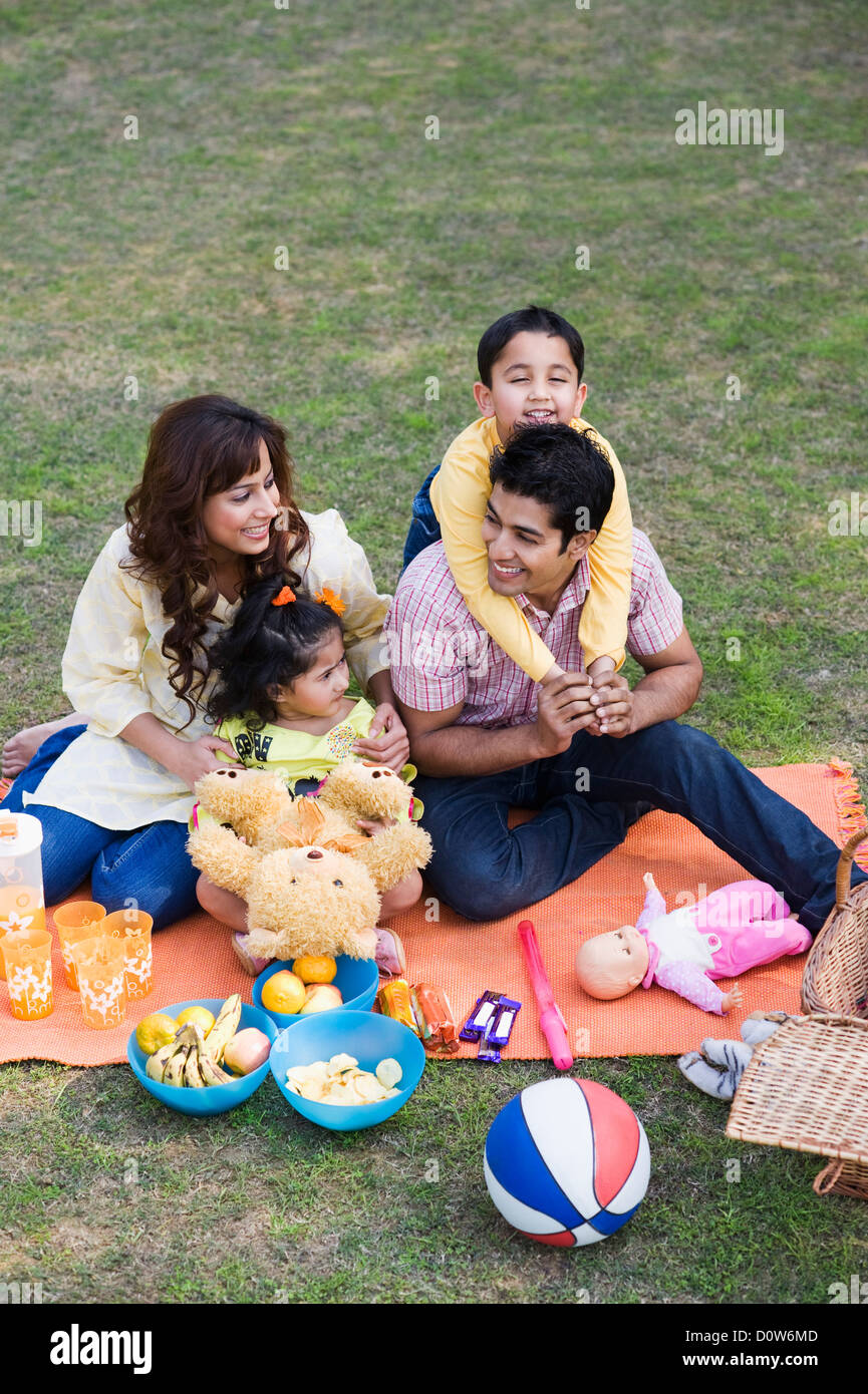 Family enjoying picnic in a garden, Gurgaon, Haryana, India Stock Photo ...