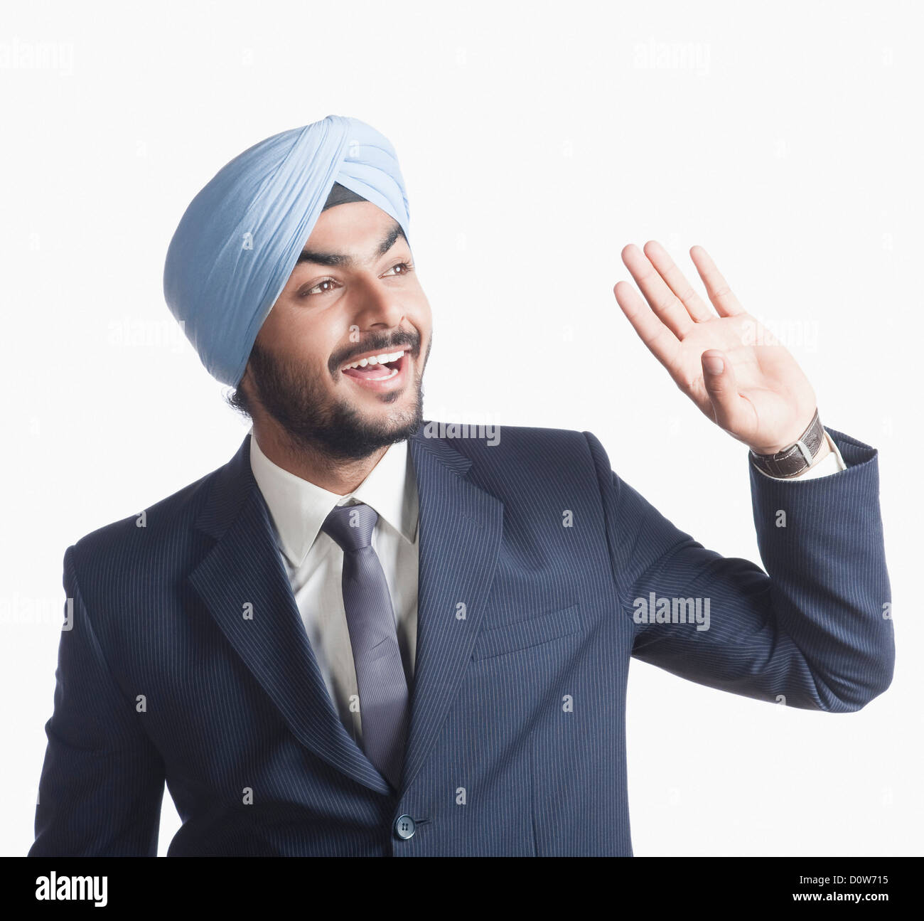 Businessman waving his hand Stock Photo - Alamy