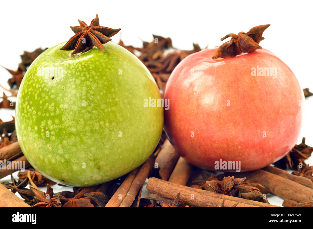 Green and pink apple with spices close up Stock Photo - Alamy