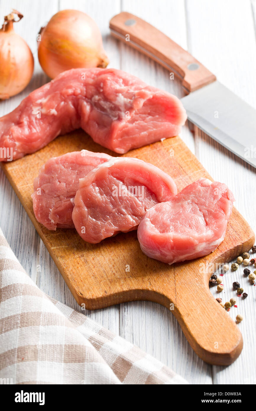 sliced raw pork meat on kitchen table Stock Photo - Alamy