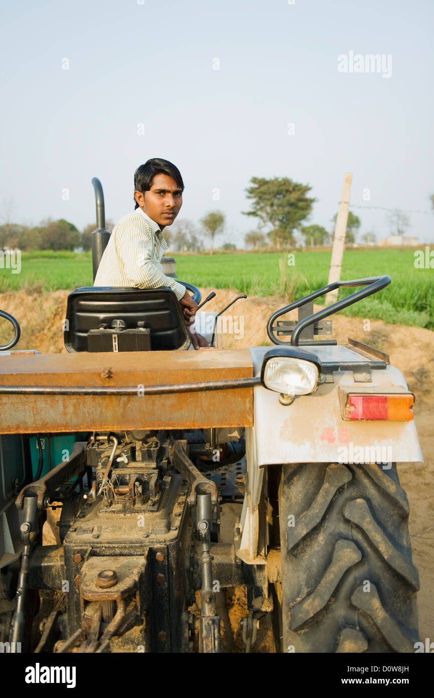 Indian farmer driving tractor hi-res stock photography and images - Alamy