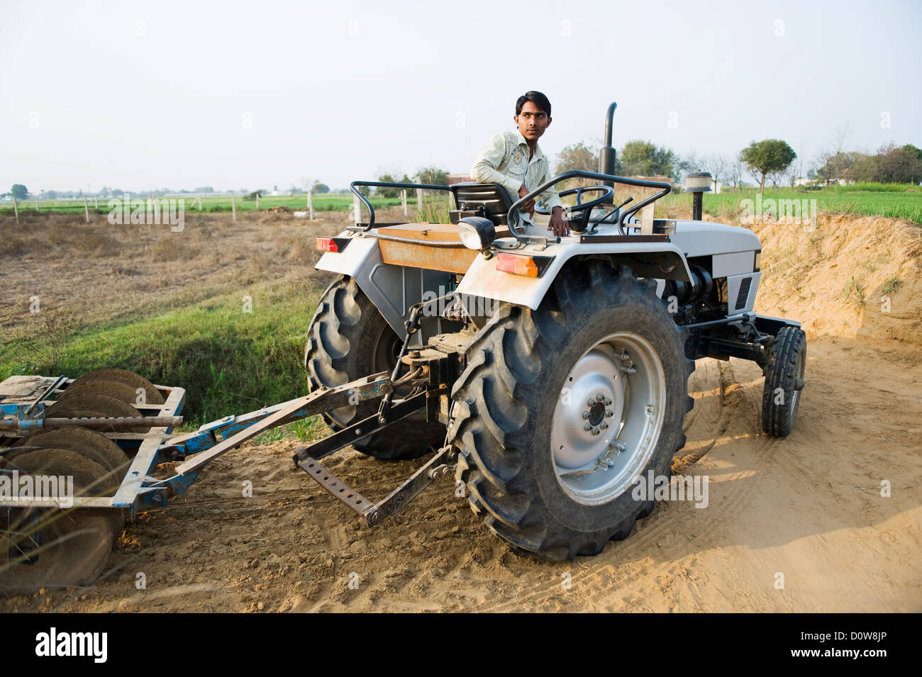 Indian farmer ploughing field tractor hi-res stock photography and images - Alamy