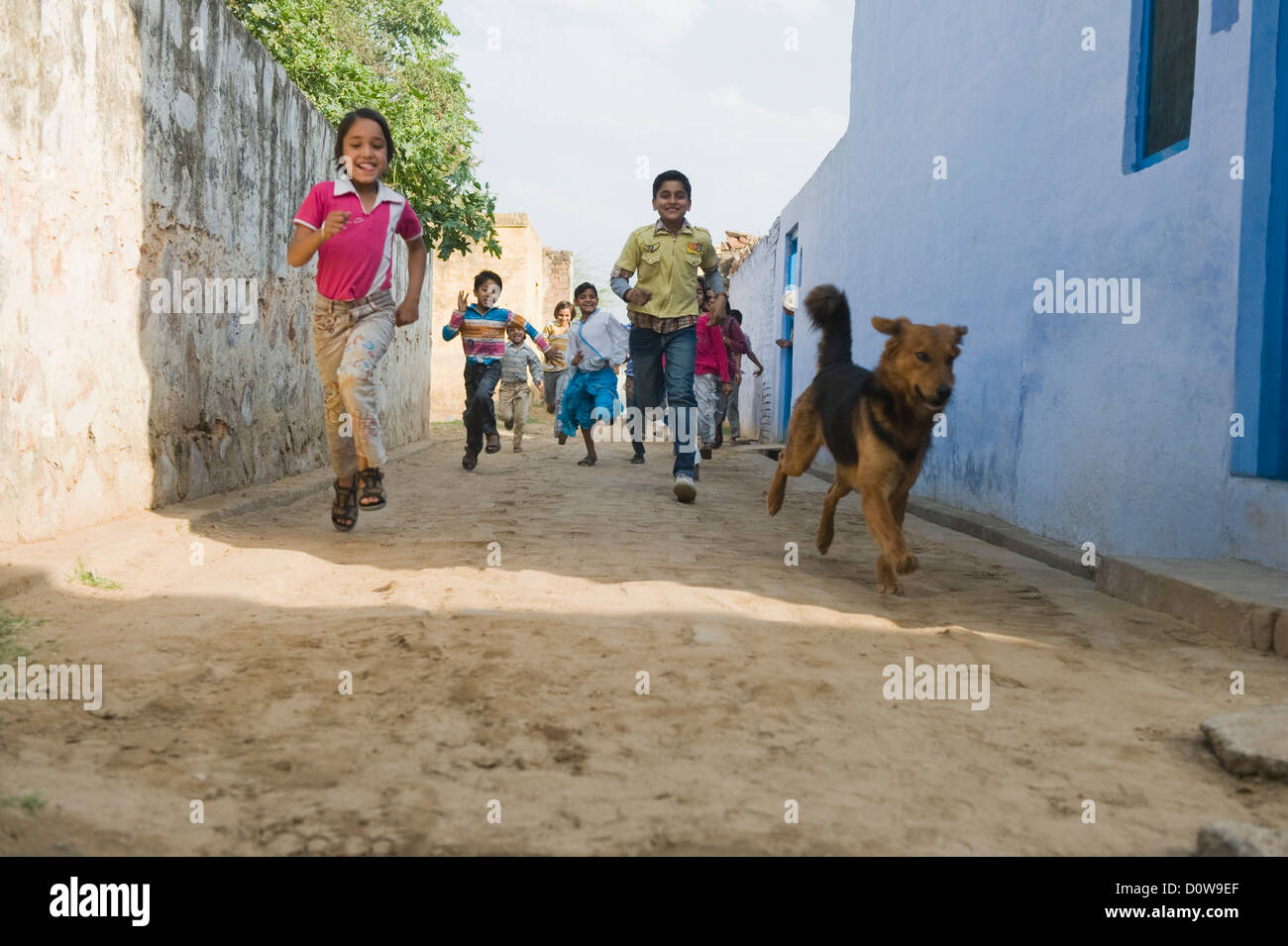 Children running in a street, Hasanpur, Haryana, India Stock Photo - Alamy