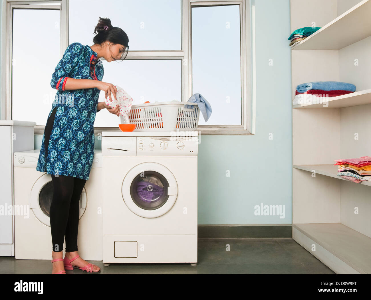 Woman doing laundry Stock Photo - Alamy