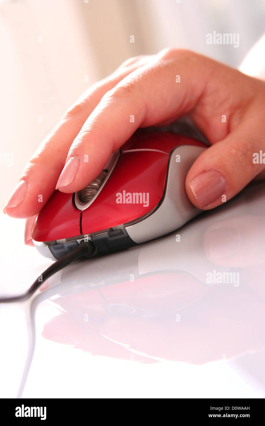 Computer red mouse and female hand with reflection Stock Photo - Alamy