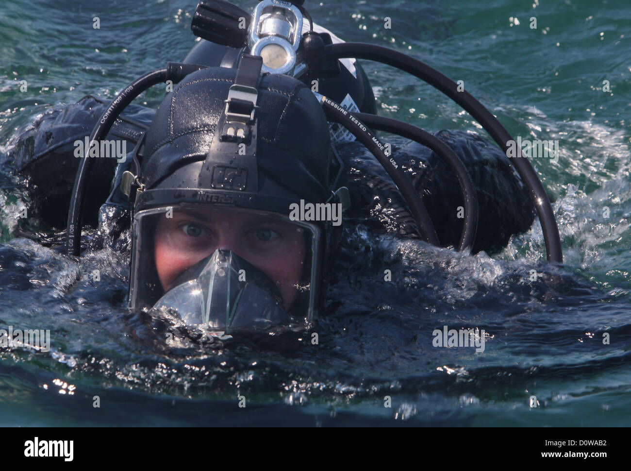 A US Marine Corps Sergeant swims to the dive platform during SCUBA ...