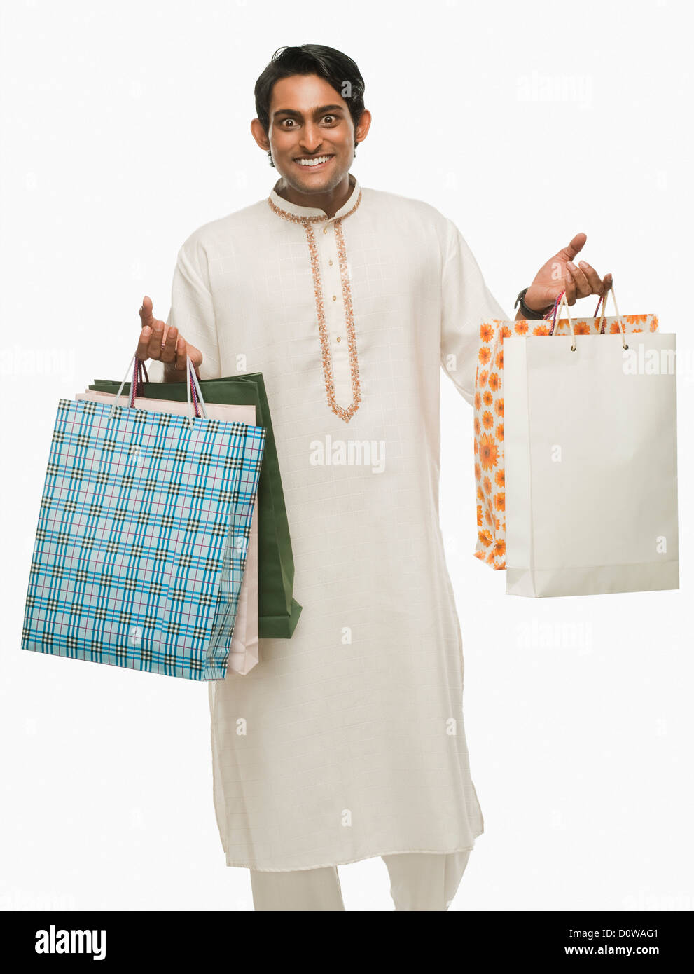 Bengali man carrying shopping bags and smiling Stock Photo - Alamy