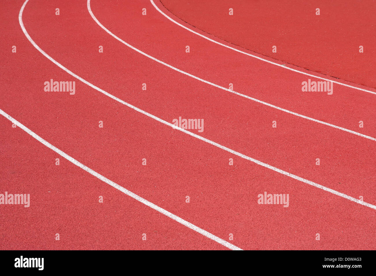 Curve of the running track- red sport background Stock Photo - Alamy
